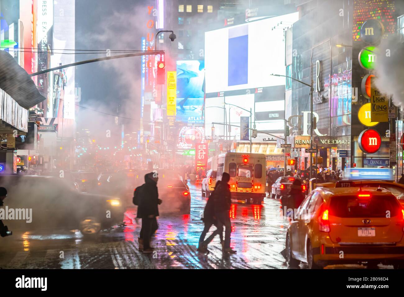 The drifting steam surrounds people, traffic and Times Square buildings ...