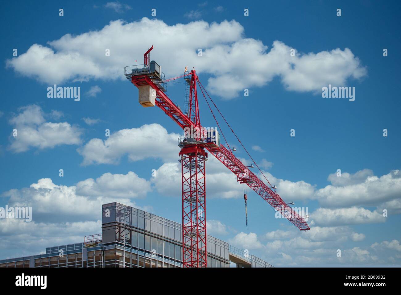 Red Crane on Top of Construction Site Stock Photo - Alamy