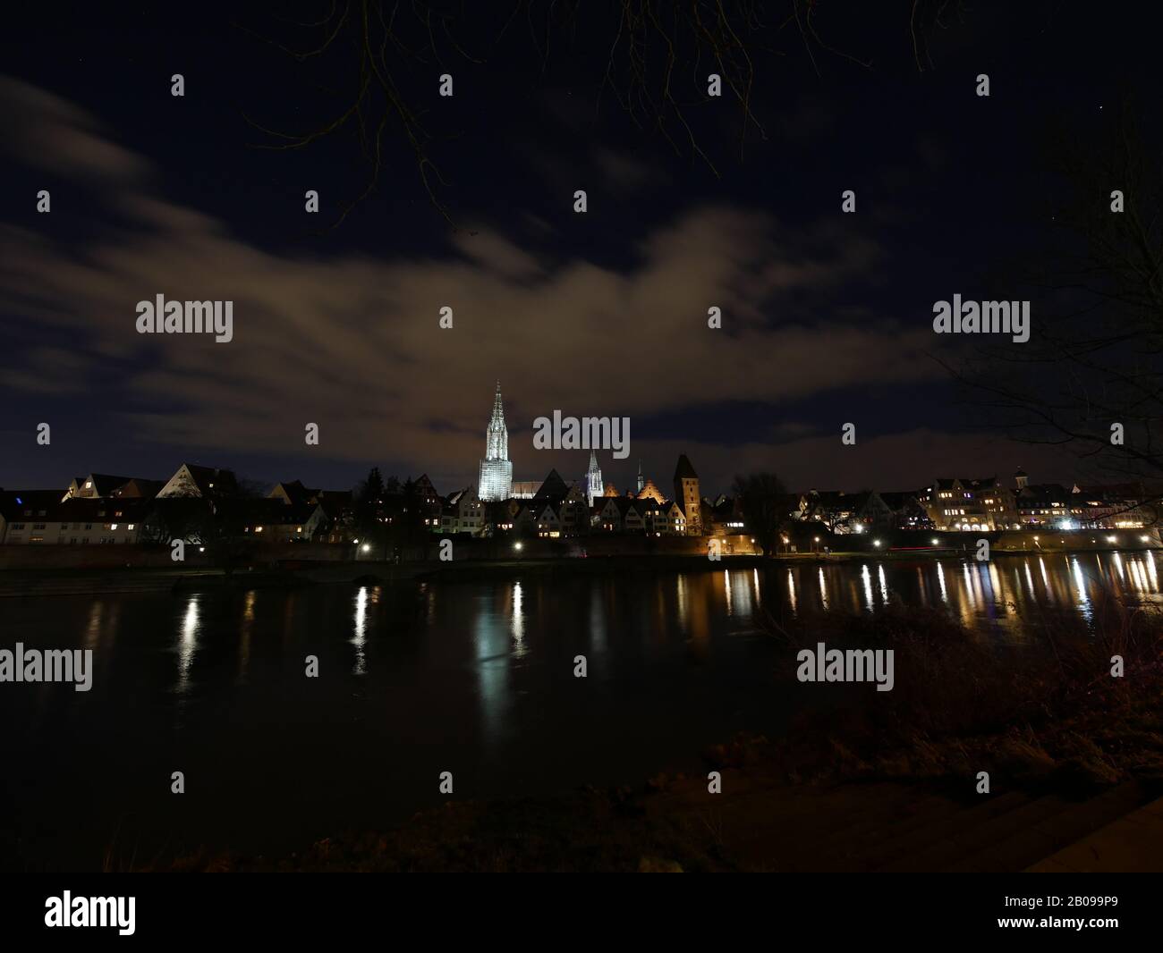 Ulm, Germany: The night skyline panorama is reflected in the Donau ...