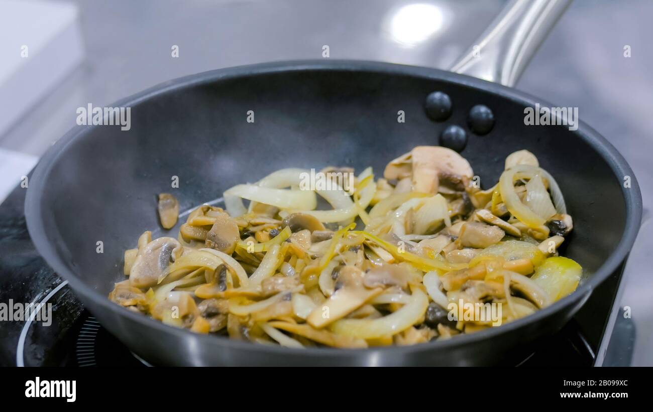 Champignon mushrooms onions frying sizzling hi-res stock photography ...