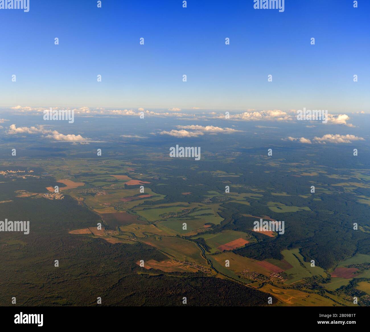 View from great height to plain with forests and villages in central ...