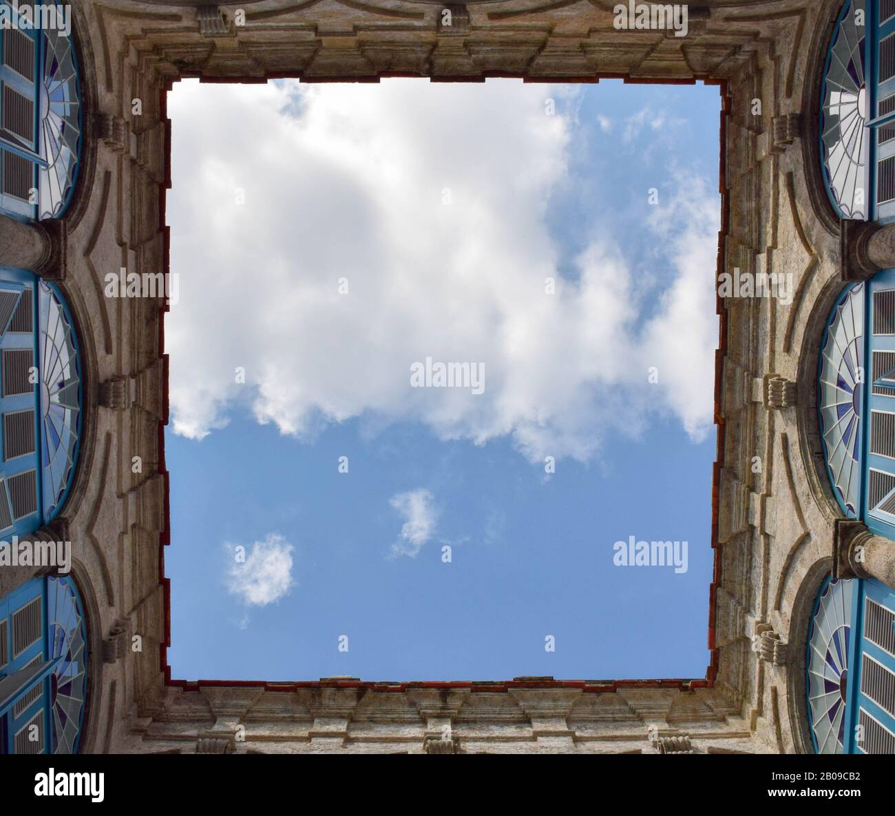 Abstract image of looking up through an old square building Stock Photo ...