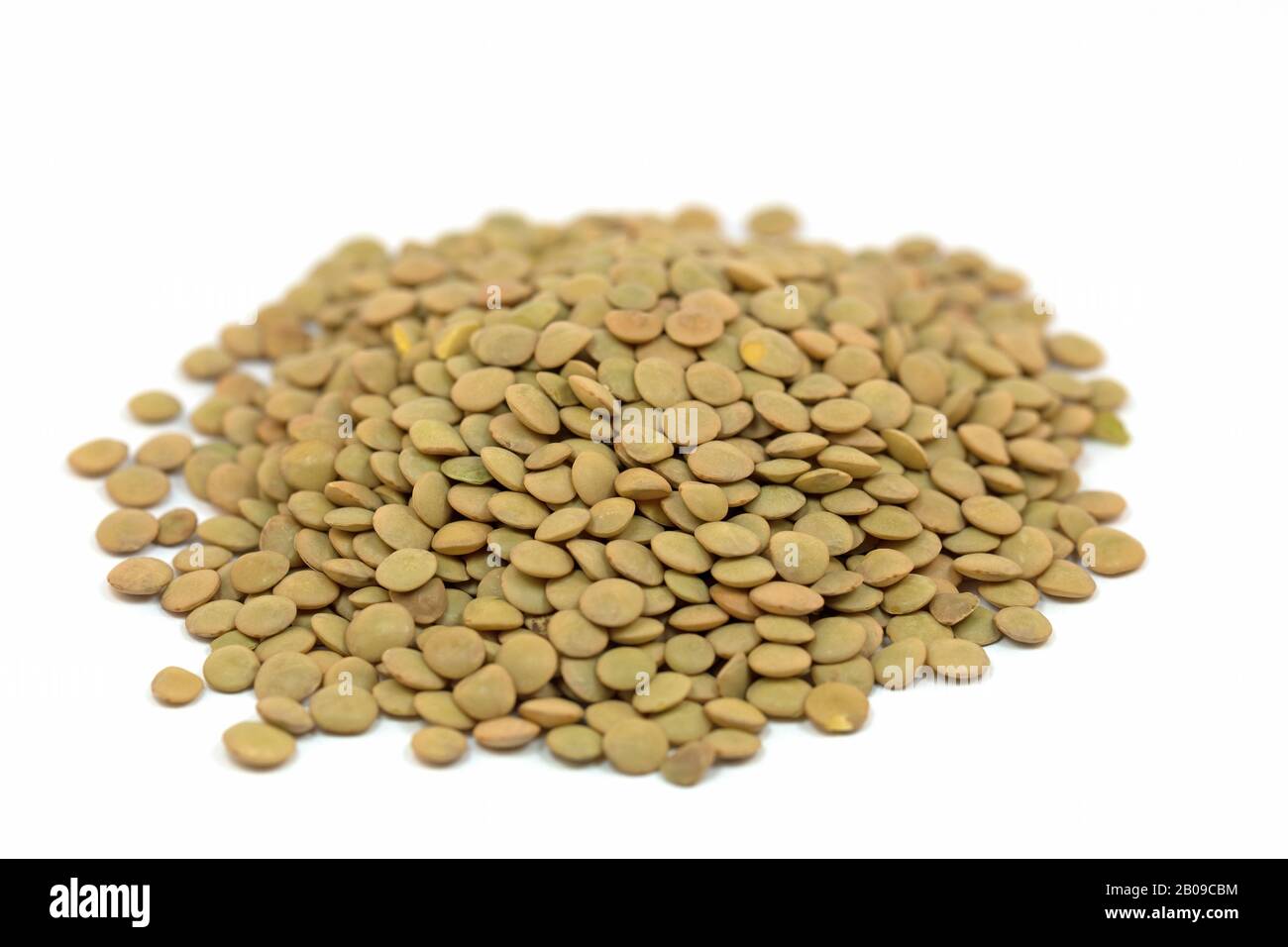 Lentils isolated against a white background Stock Photo - Alamy