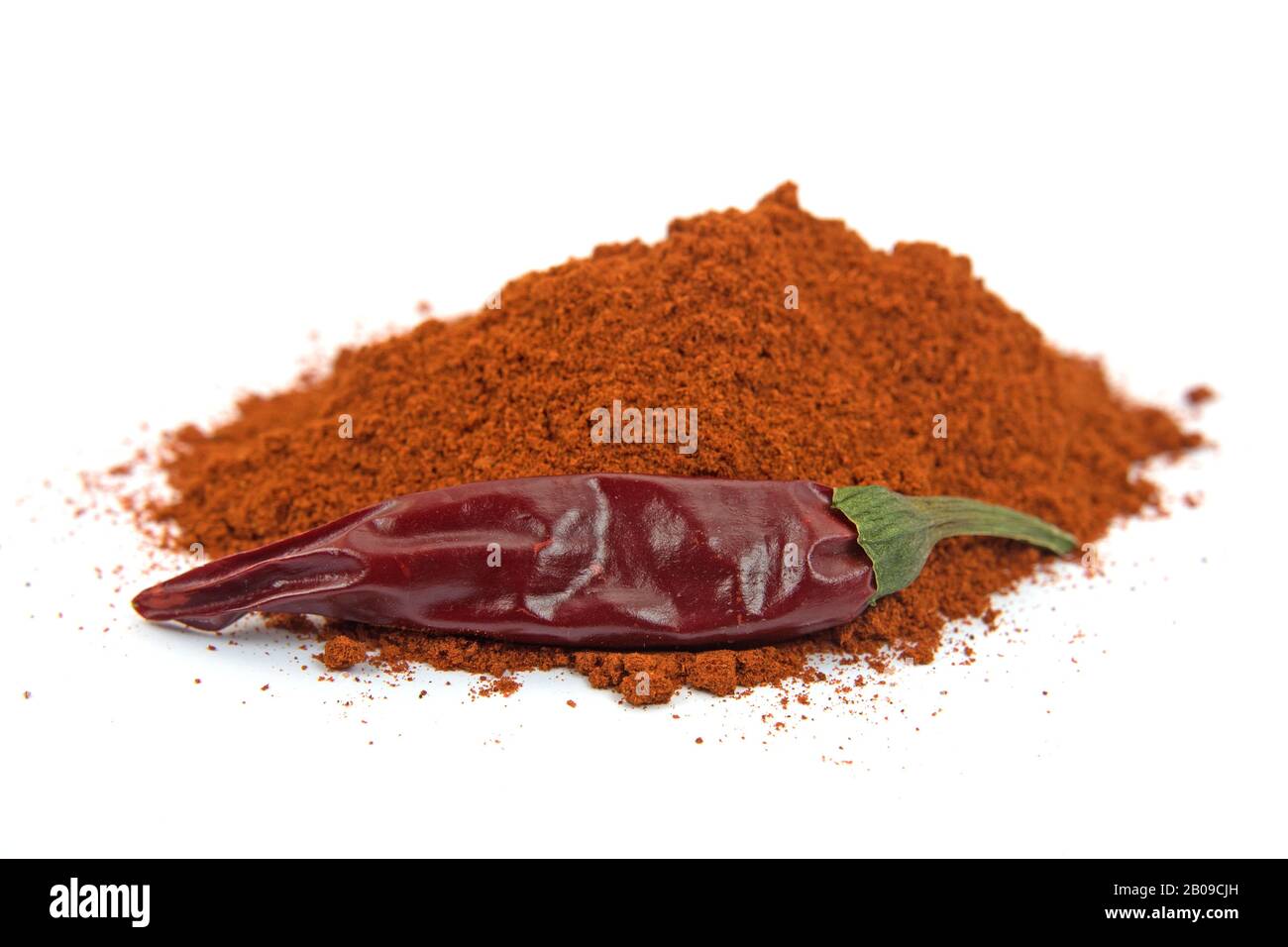 Dried pepperoni powder against white background Stock Photo - Alamy