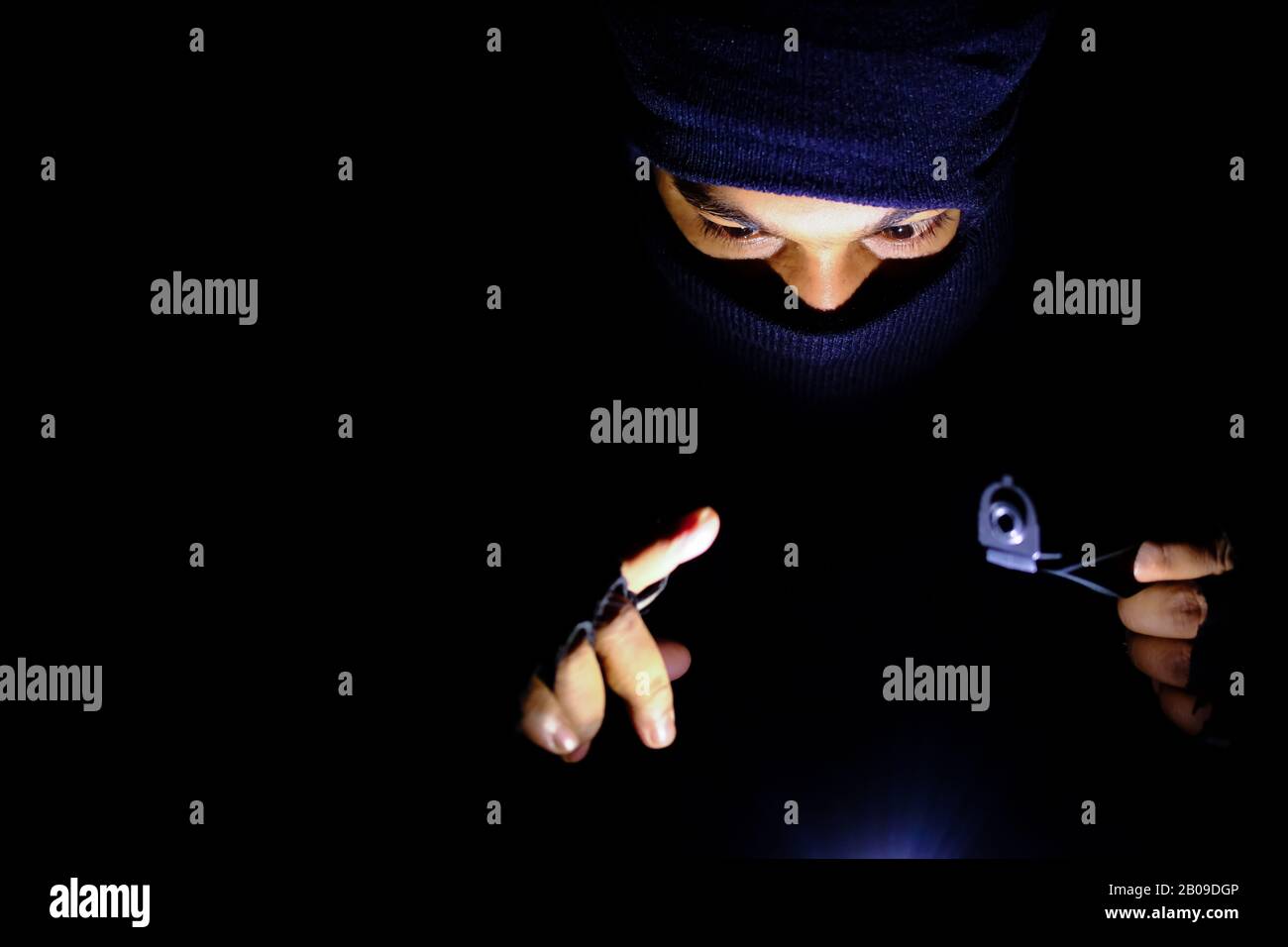 man hand with pistol doing crime at night Stock Photo - Alamy
