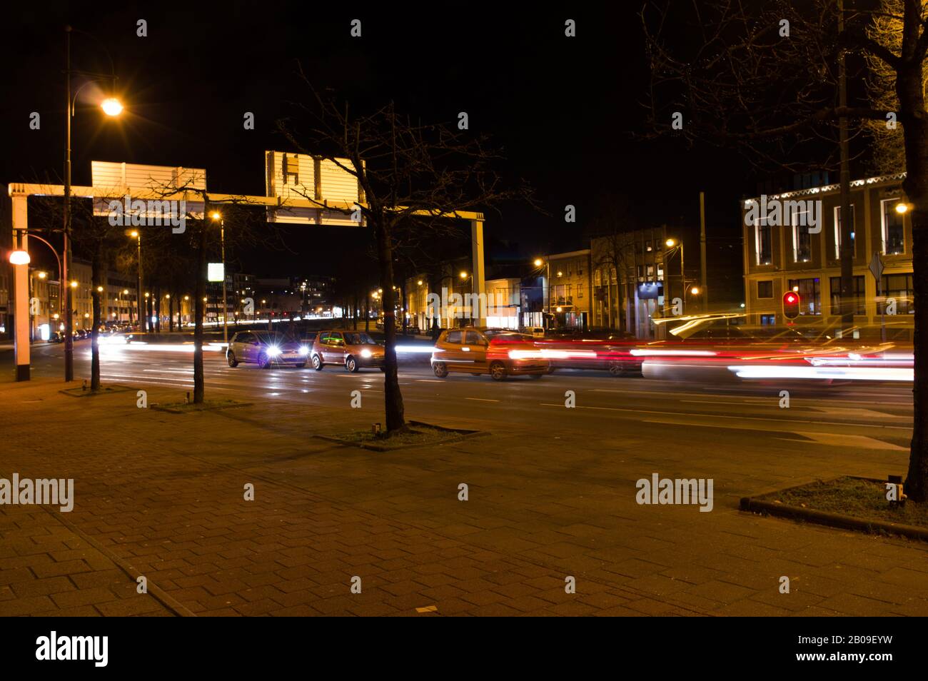 Intersection at night with traffic blurred by motion in Arnhem ...