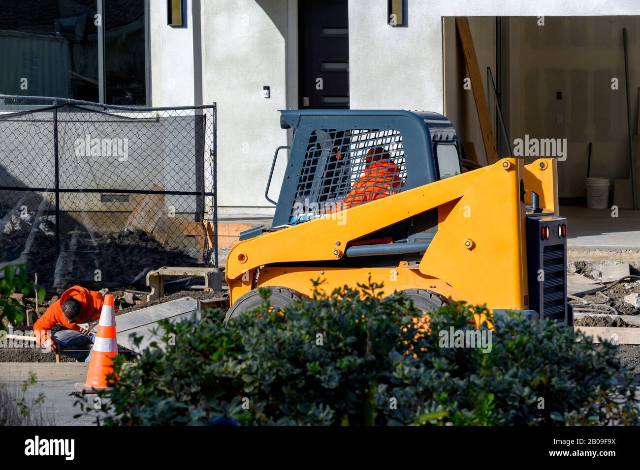 Leveling and grader machine, leveling the ground for a new driveway and ...