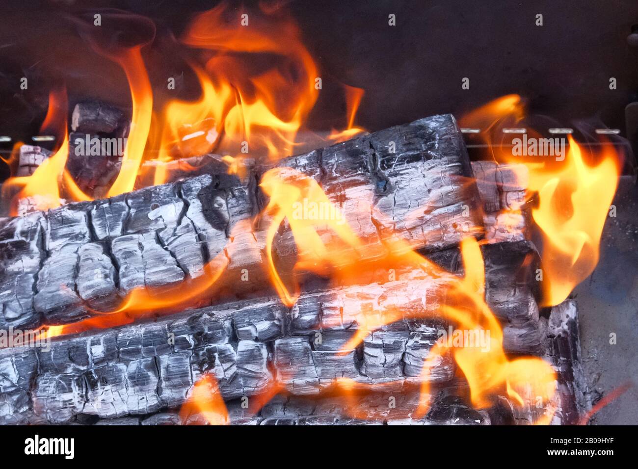 Flame in fireplace close up. Flames, burning woods and smoke Stock ...