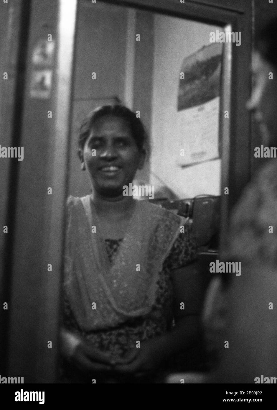 Rojina laughs into the mirror, where her own reflection is unknown to ...