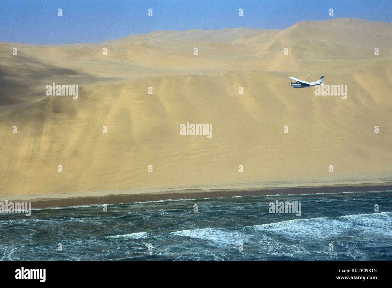 NAMIBIA, SKELETON COAST NATIONAL PARK, PLANE FLYING ALONG COAST, SAND ...