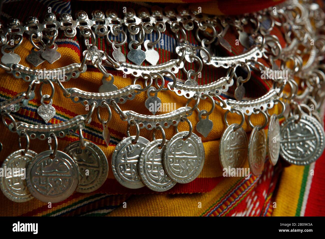 A woman from the Garo community wears a traditional ornament round her ...