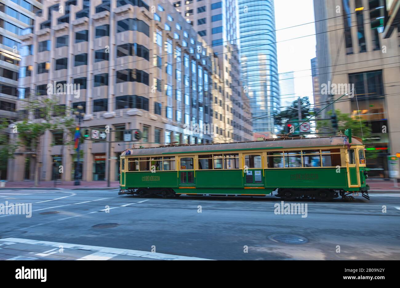 Camera panning of an electric moving trolley car at Market Street in ...