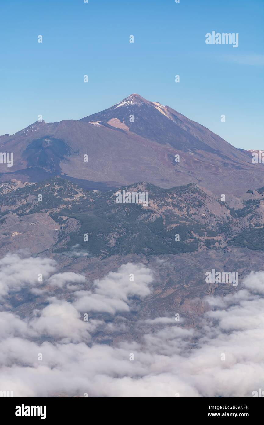 Aerial overcloud view on Tenerife island from airplane, peak of Mount ...