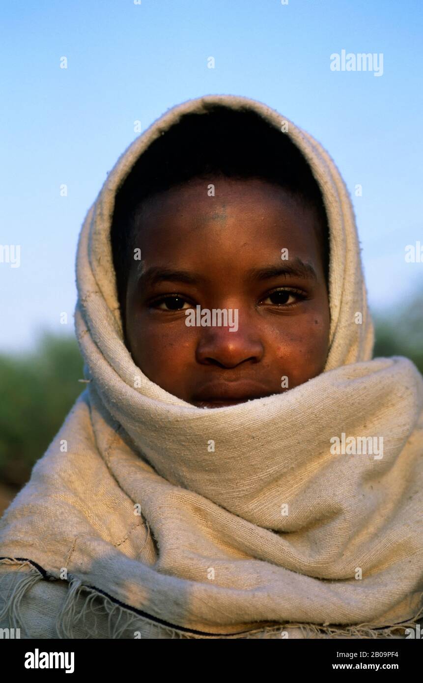 ETHIOPIA, NEAR BAHAR DAR, SMALL VILLAGE, BOY DRAPED IN CLOTH Stock ...