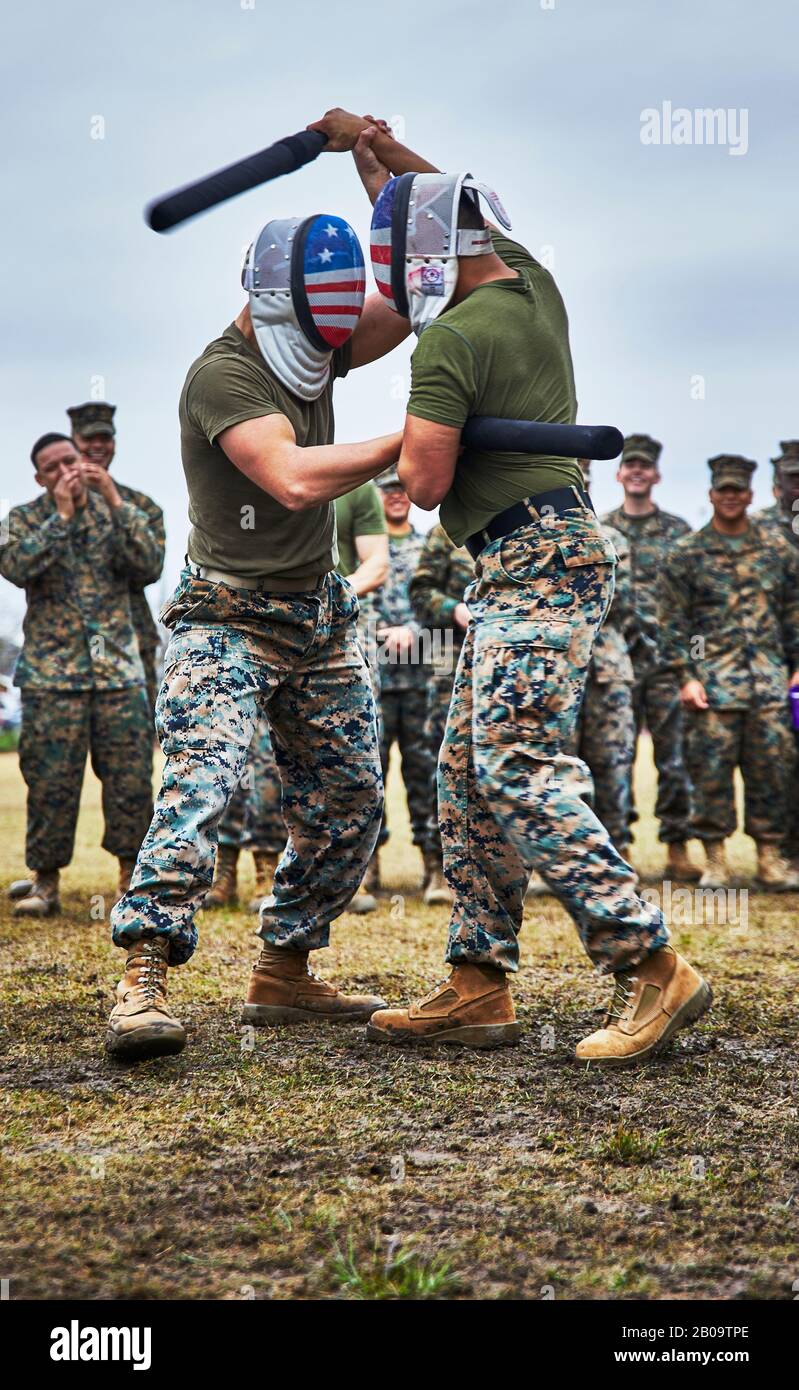 U.S. Marine participate in baton fighting during the King of the Ring ...