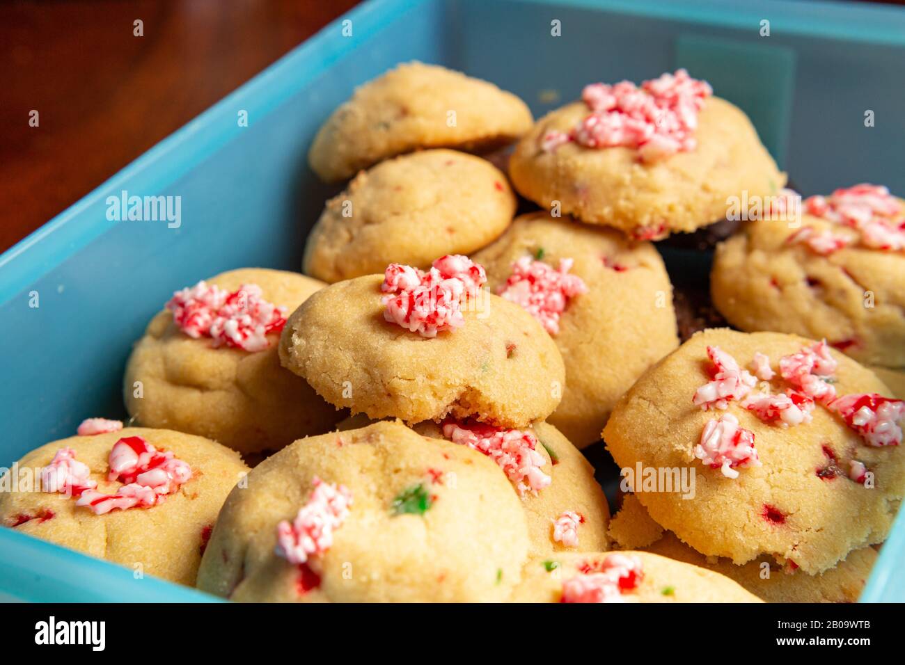Blue plastic container full of crushed candy can peppermint sugar ...