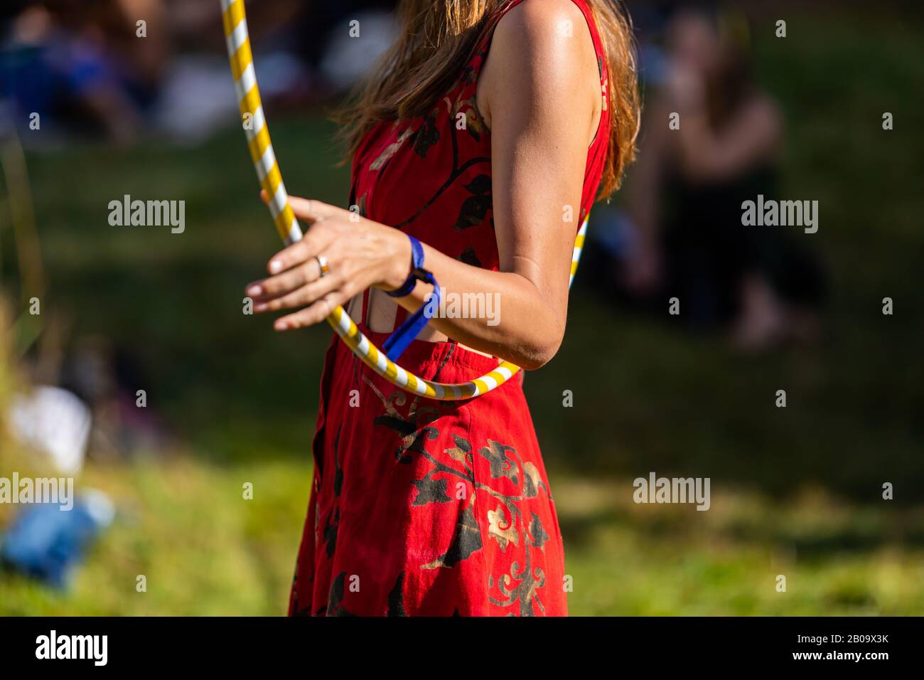 A side profile midsection view in soft focus of a healthy woman with ...