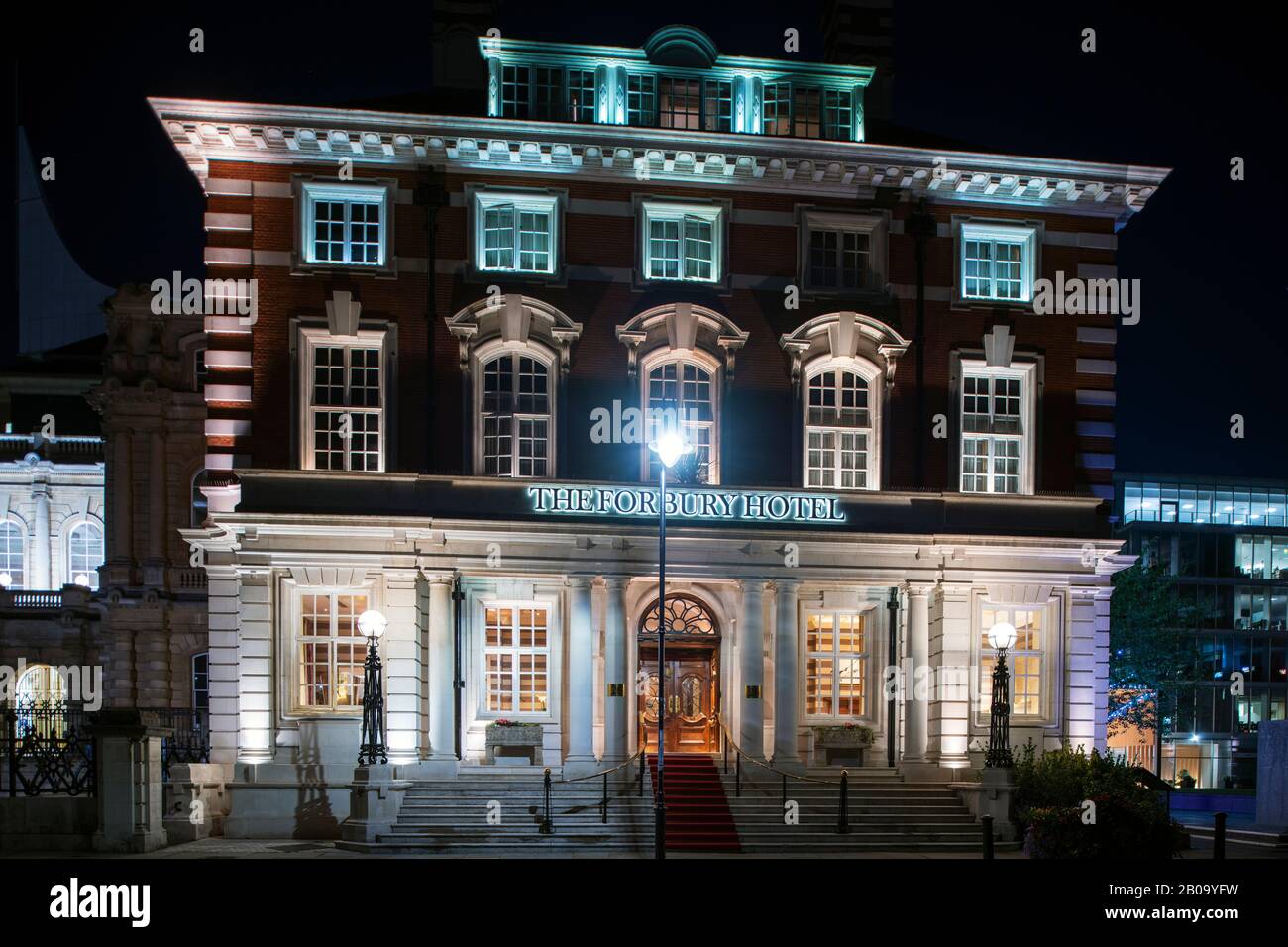 Illuminated building at night Stock Photo - Alamy