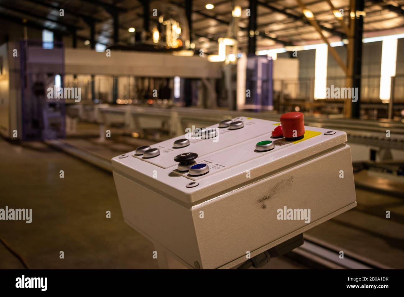 Red button in a factory Stock Photo - Alamy