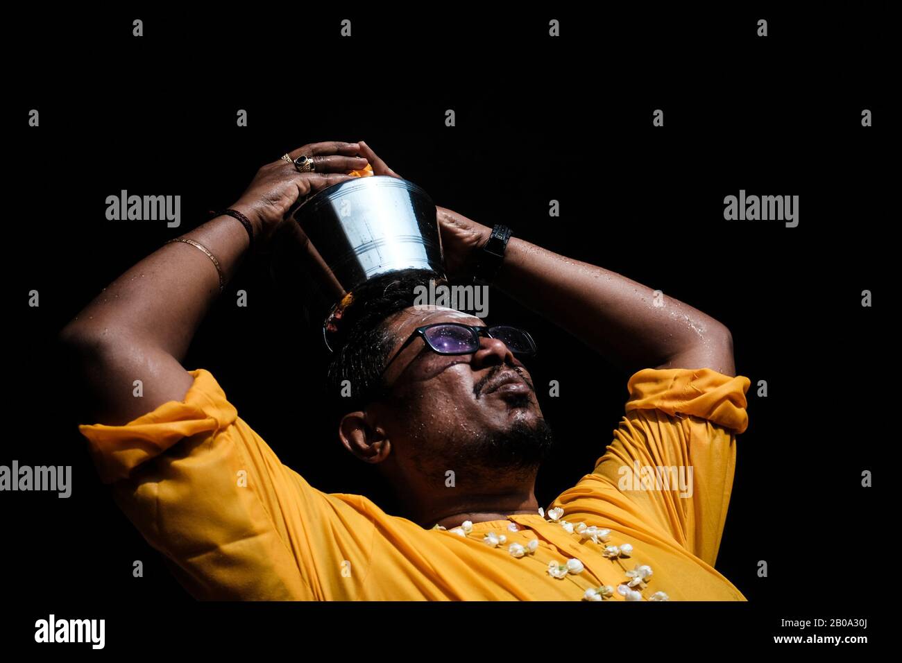 A devotee carrying "Paal Kudam" (milk pot) containing cow's milk as ...