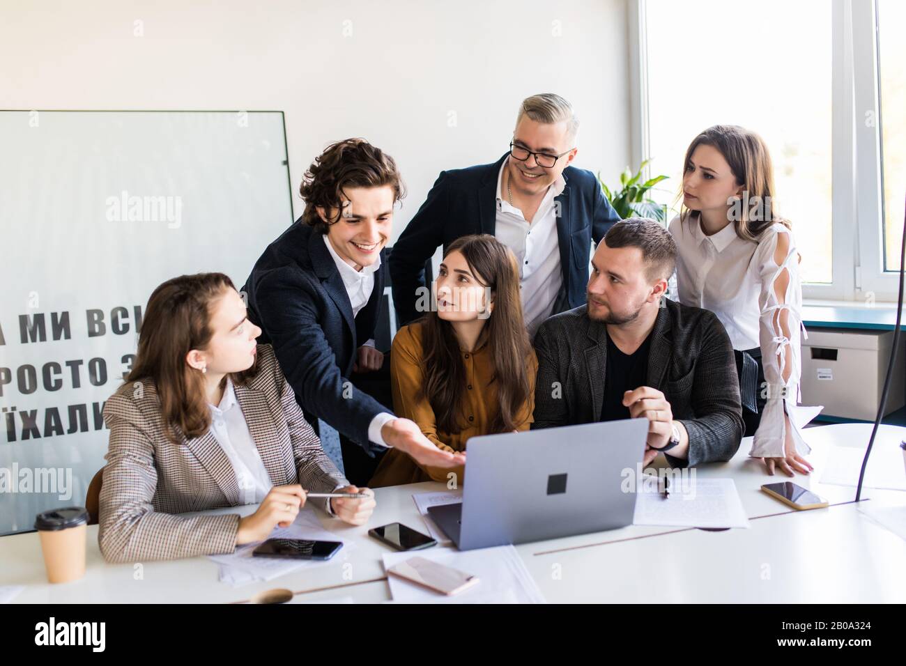 Diverse business partners smiling using hi-res stock photography and ...