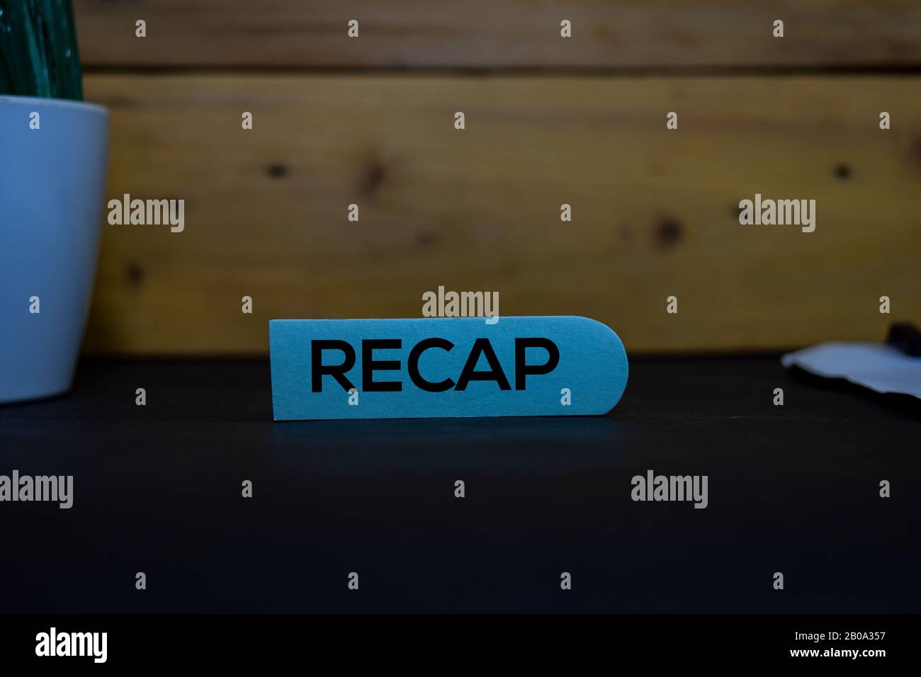 Recap write on a sticky note isolated on wooden background Stock Photo ...