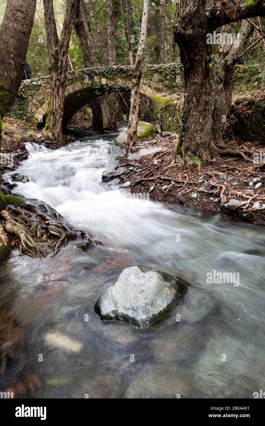 Beautiful medieval stoned bridge or Milia with river full with water ...