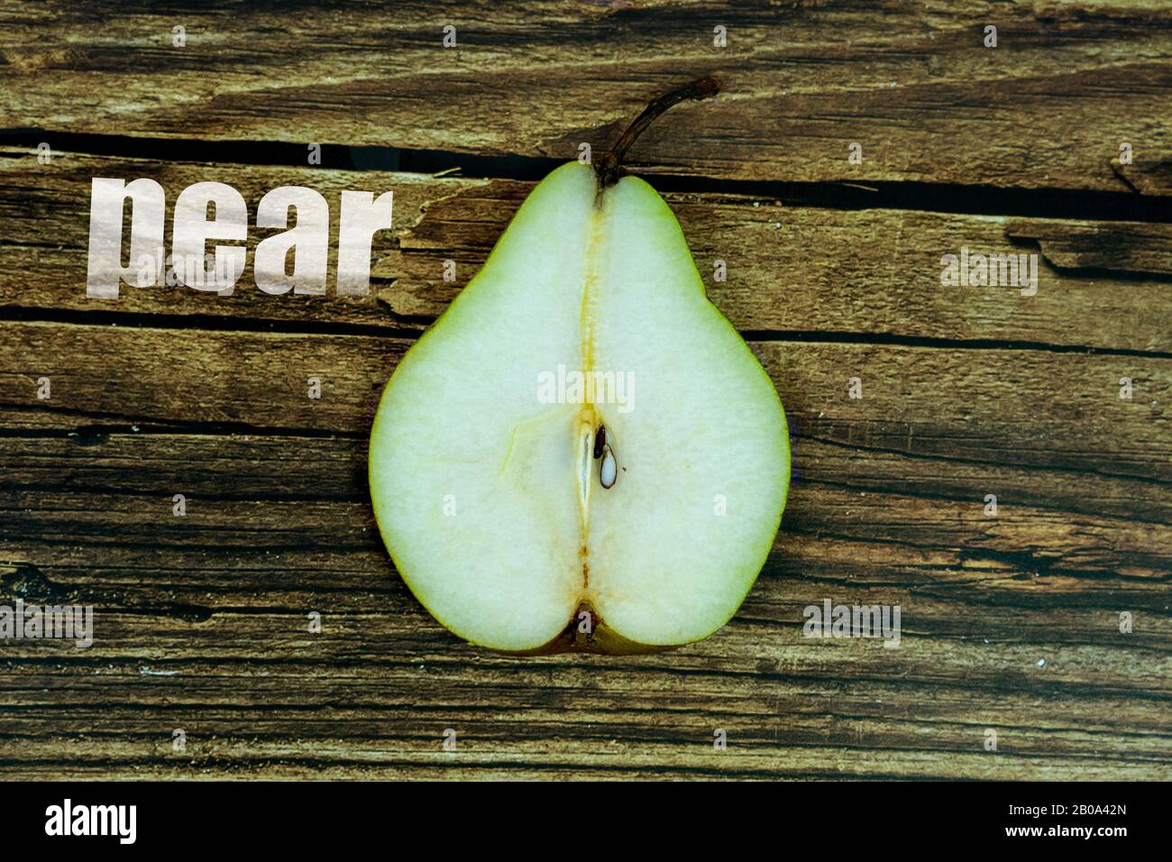 cutted pear slice on wooden rustic background minimalism Stock Photo ...