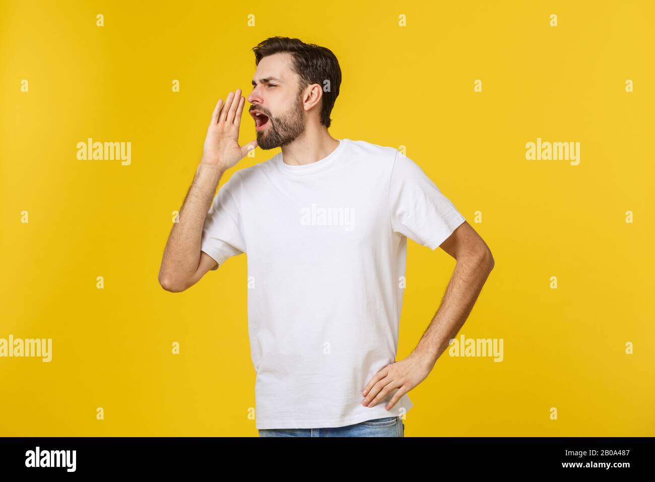 Portrait of a young man shouting loud with hands on the mouth Stock ...
