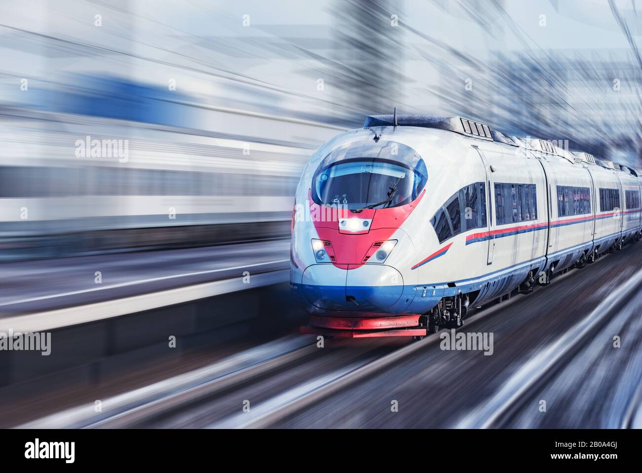 Highspeed train approaches to the station platform Stock Photo - Alamy