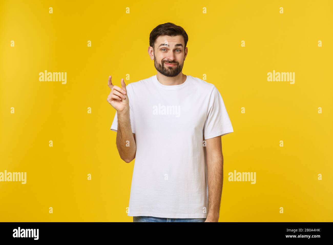 Caucasian man show small size by fingers demonstrate tiny measure, tell ...