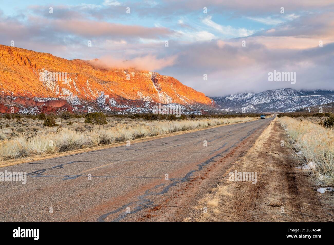 Winter sunset over a highway through Castle Valley in the Moab area ...