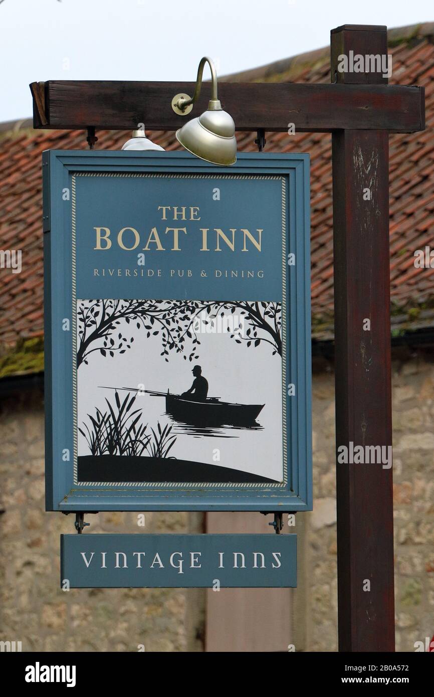 Pub signage for the boat inn with its simple boat image Stock Photo - Alamy