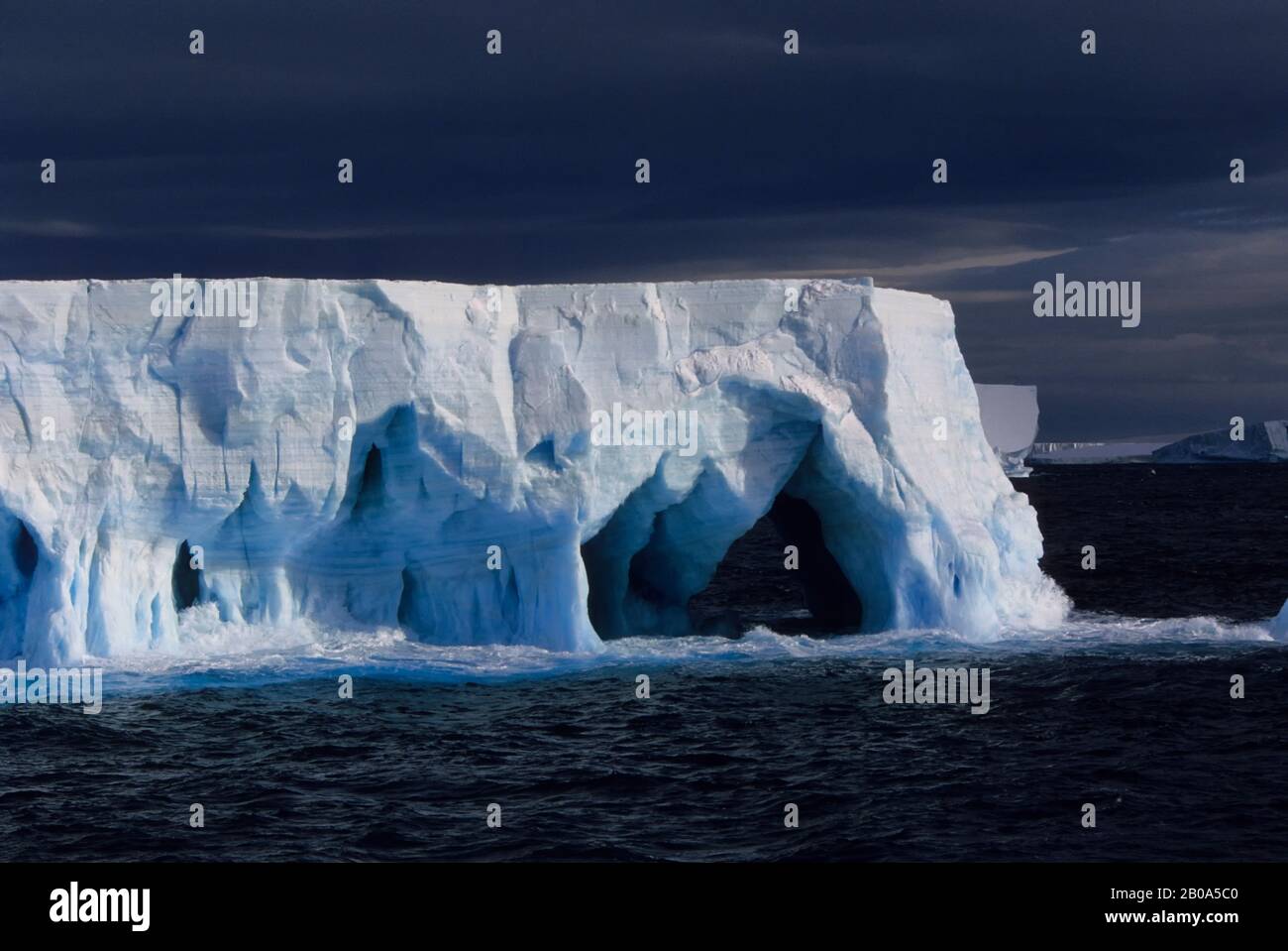 ANTARCTICA, TABULAR ICEBERG WITH CAVES & ARCHES Stock Photo - Alamy