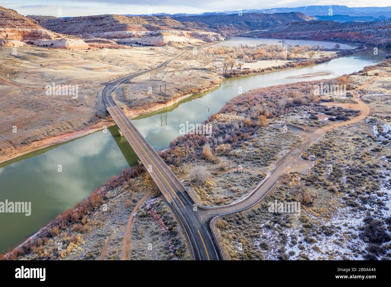 highway across Colorado River with the remains of historic Dewey Bridge ...