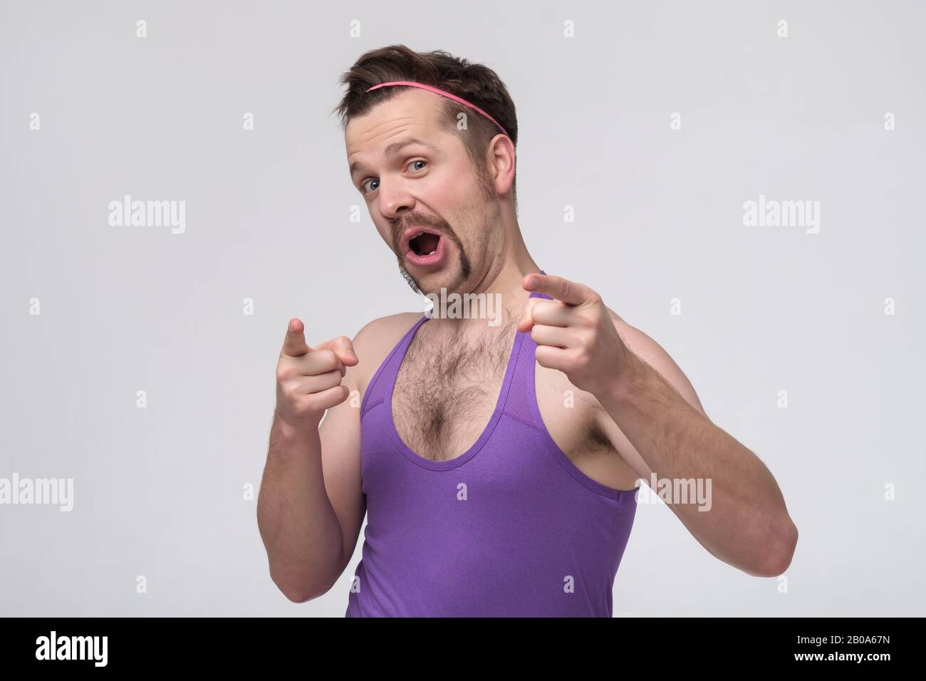 Sportive retro man points a finger at camera choosing you. Stand up and ...