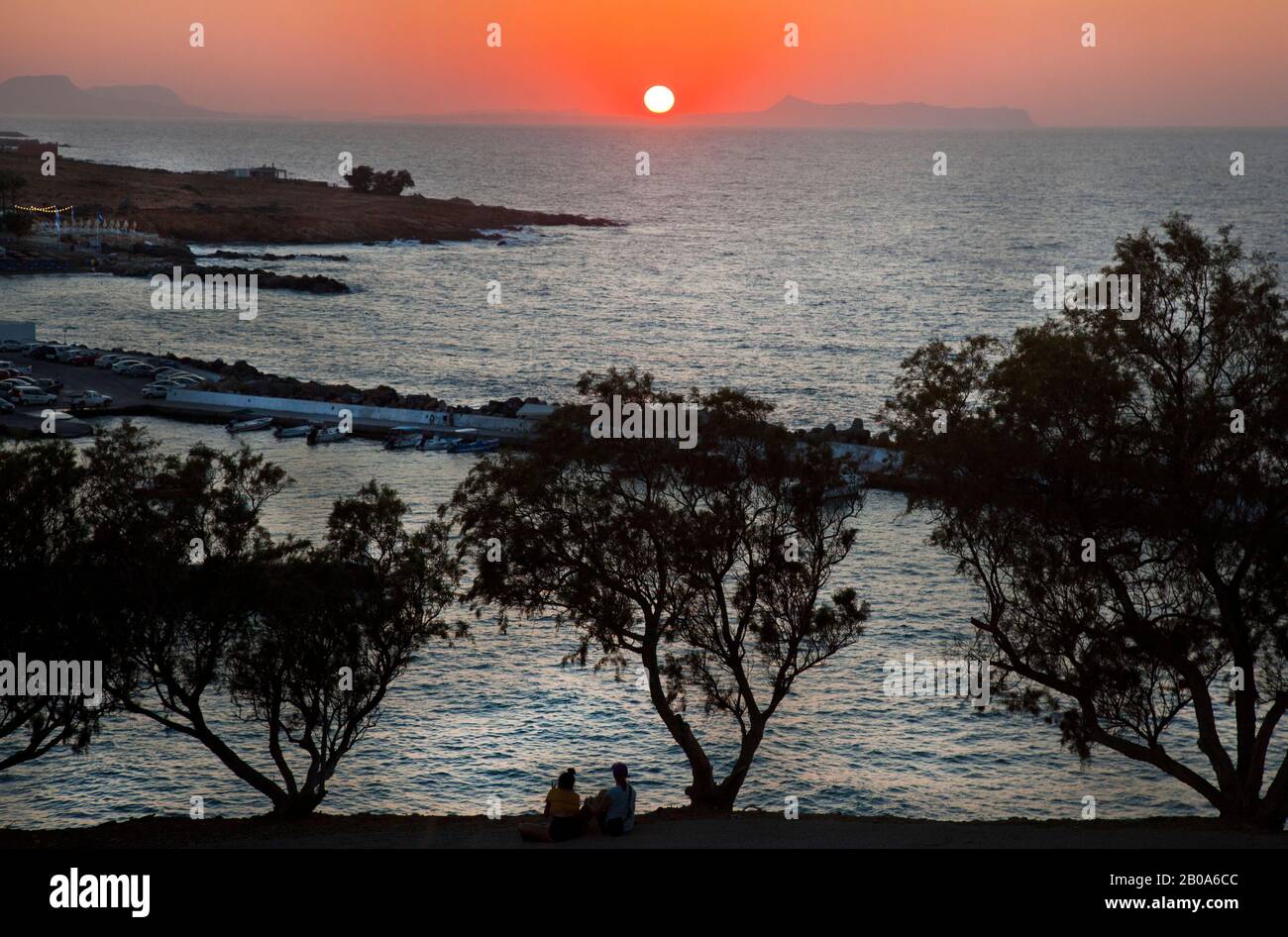 Sunset over Panormos ( Panormo ) in Crete. Panormos is a small Cretan ...