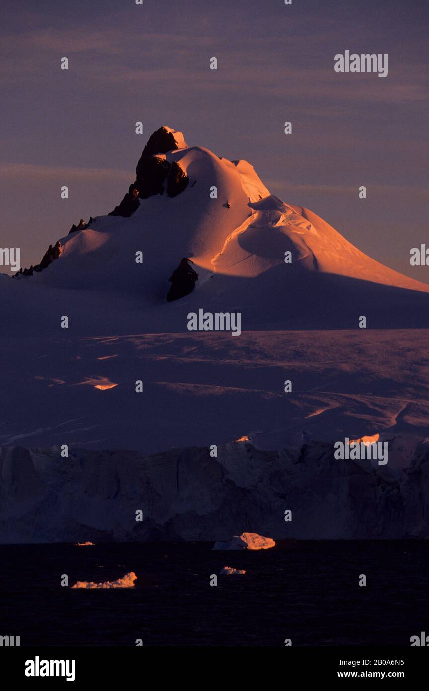 ANTARCTIC PENINSULA AREA, GLACIER COVERED MOUNTAIN IN MIDNIGHT SUNLIGHT ...