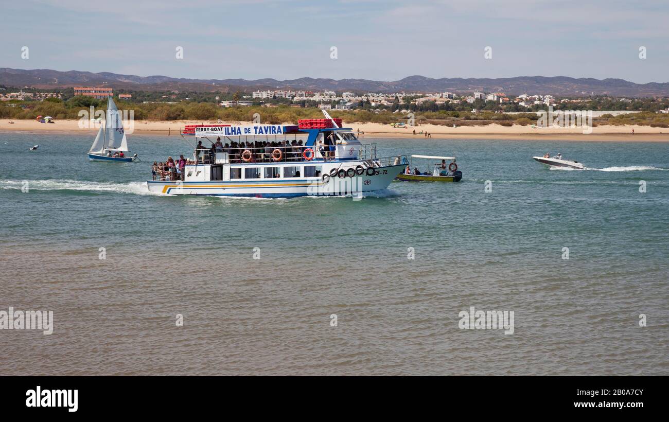 A tourist boat / ferry used to reach the beach at Praia da Ilha de ...