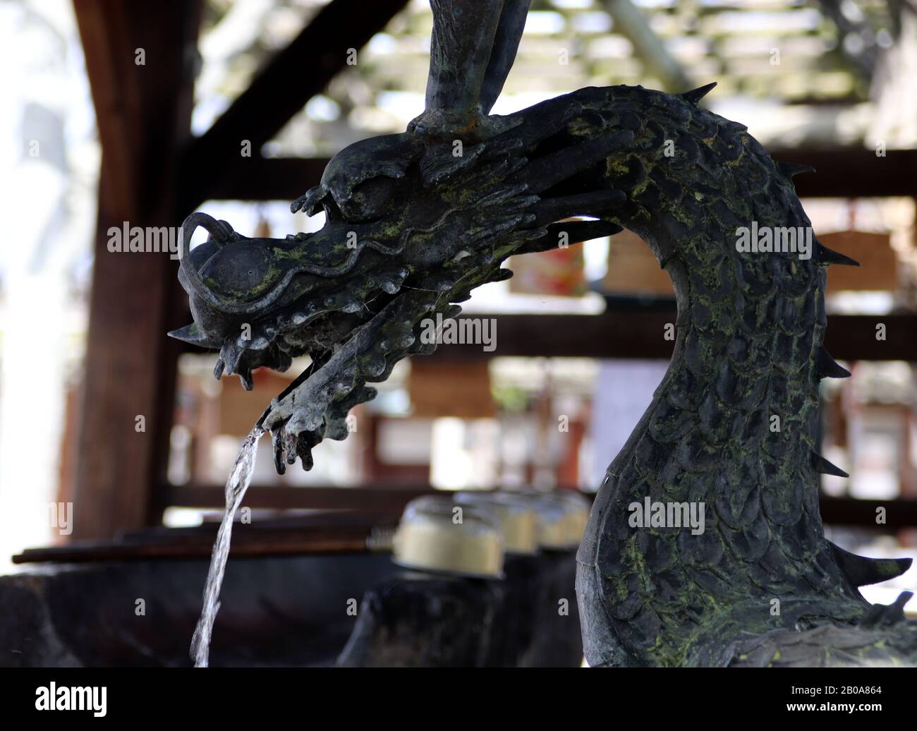 Japanese shinto shrine dragon fountain Stock Photo - Alamy