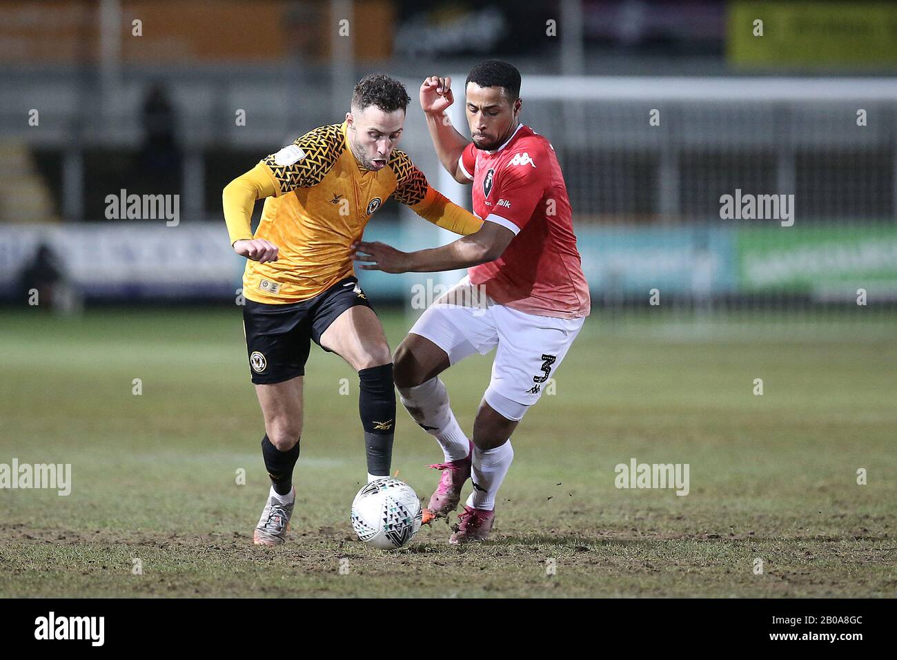 Newport, UK. 19th Feb, 2020. Robbie Willmott of Newport County takes on ...