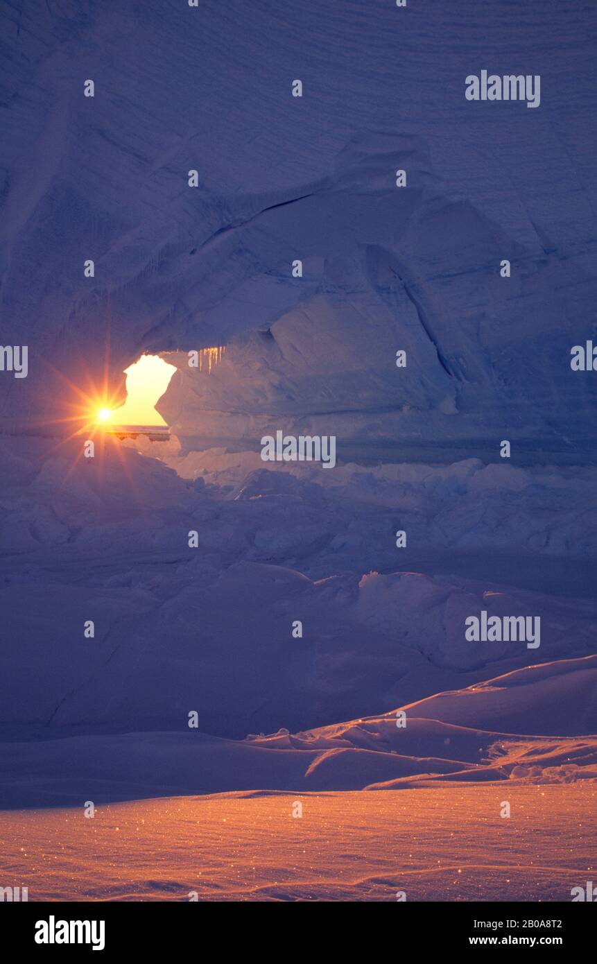 ANTARCTICA, ATKA ICEPORT, ICEBERG WITH ARCH, MIDNIGHT SUNSHINE ...