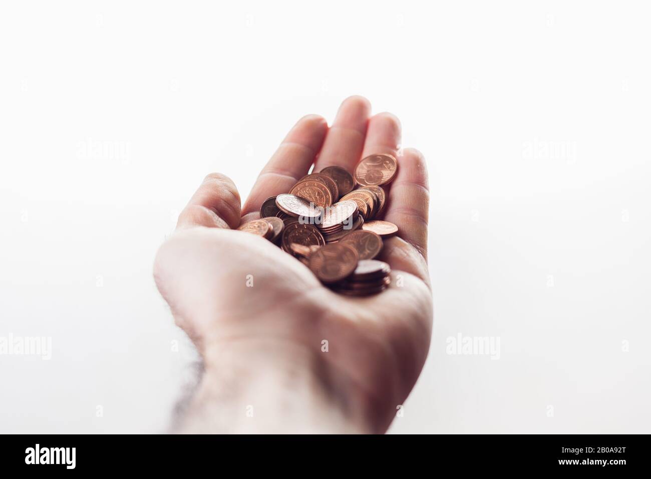 Showing a bunch of coins in hand Stock Photo - Alamy