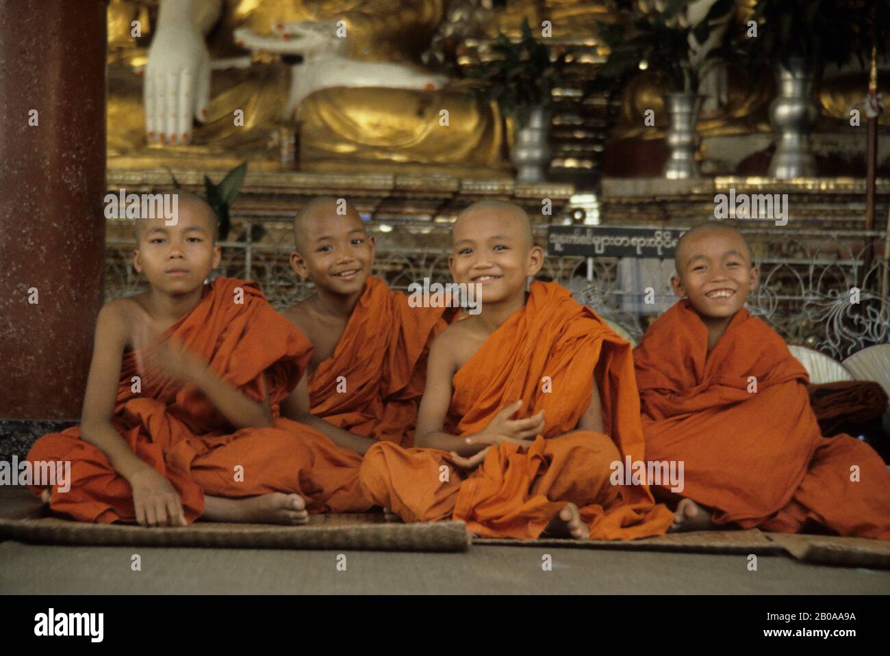 MYANMAR (BURMA), YOUNG MONKS IN SAFRON ROBES IN SWEDAGON PAGODA ...