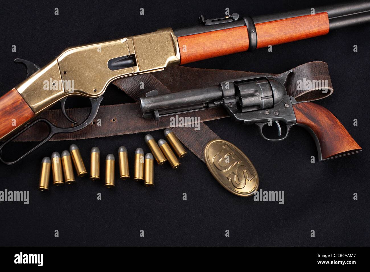 Wild west guns and ammunition on black canvas Stock Photo - Alamy