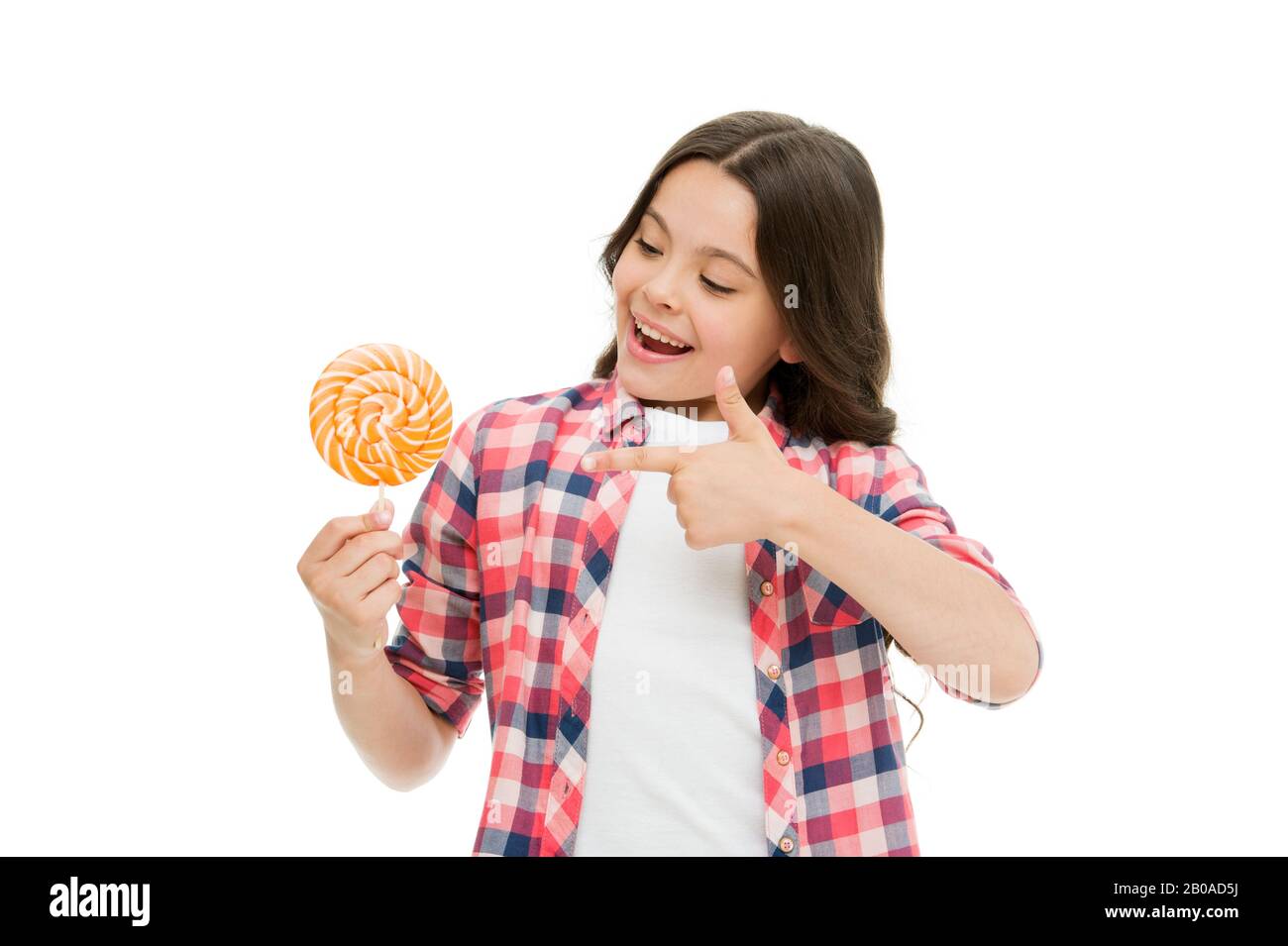 Look at this. Little girl point at candy isolated on white. Small child ...