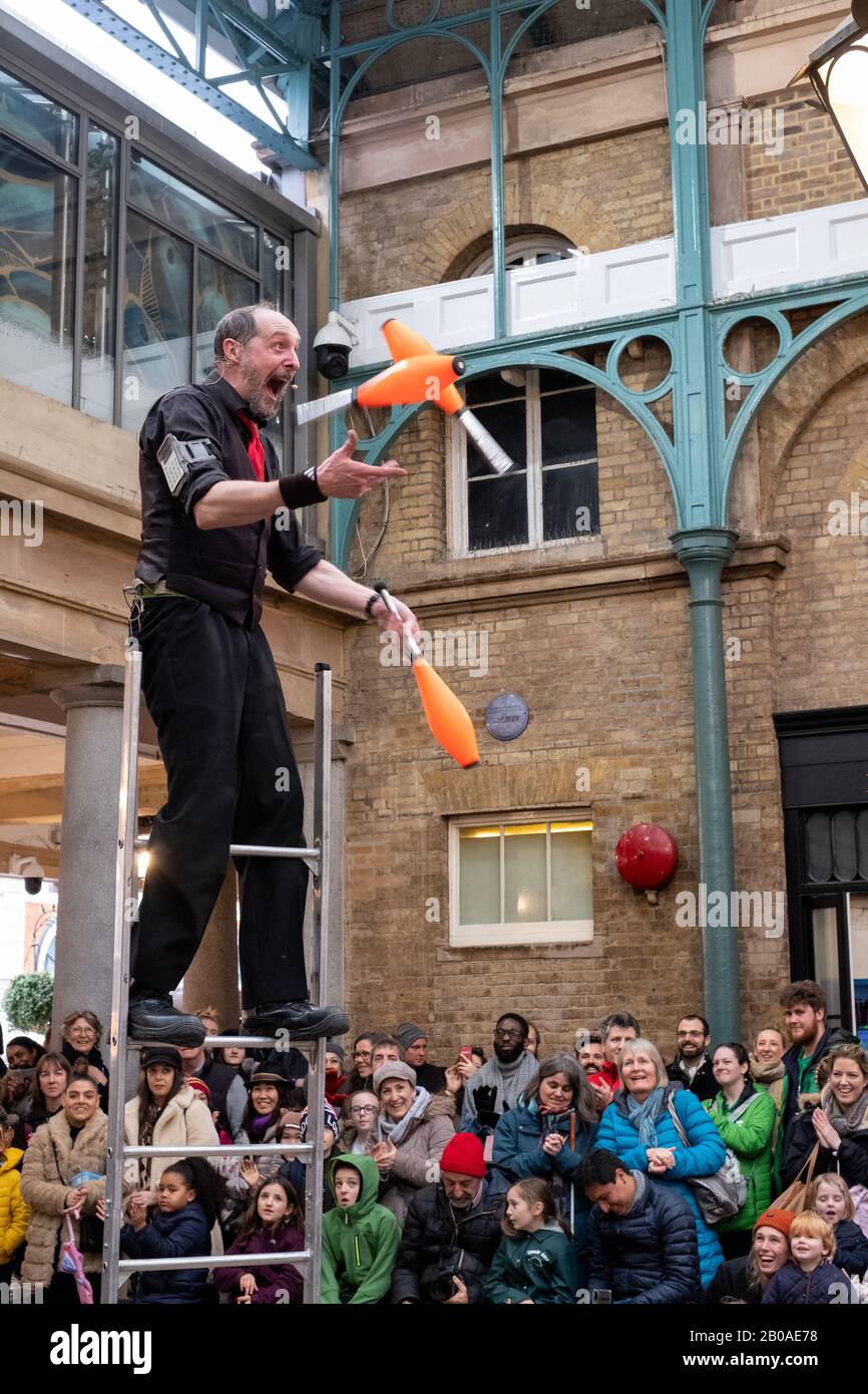Balancing on ladder hi-res stock photography and images - Alamy