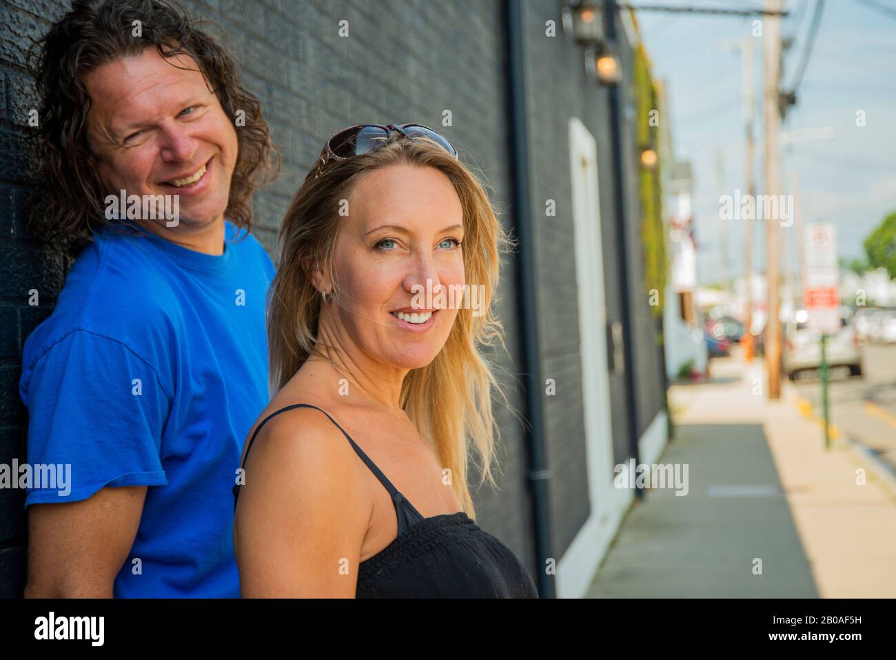 Couple posing outside for snap shot Stock Photo - Alamy