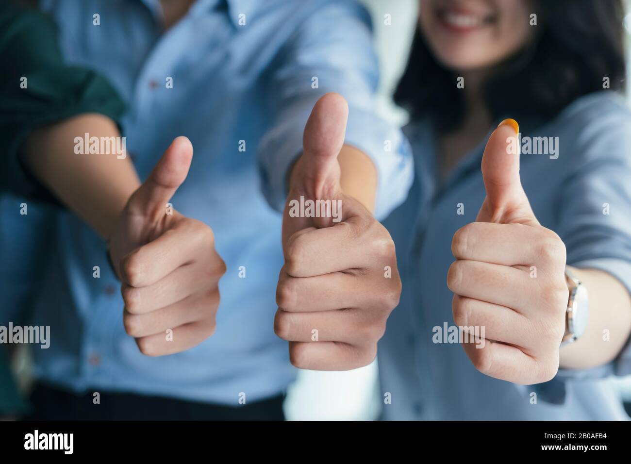 Closeup gruop of business people giving thumbs up. Group of people show ...