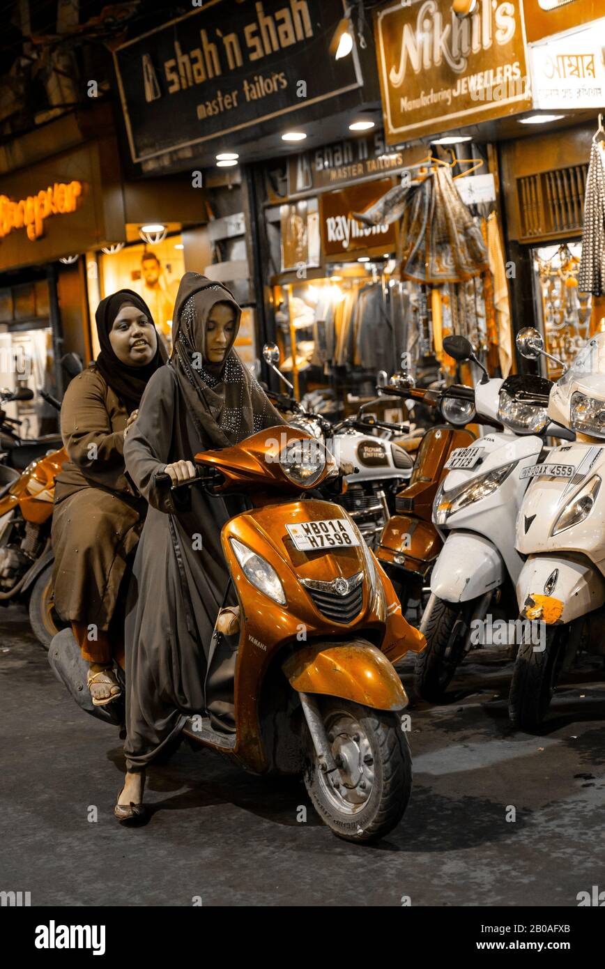 Two Muslim Indian woman on their motorcycle in Kolkata, India Stock ...